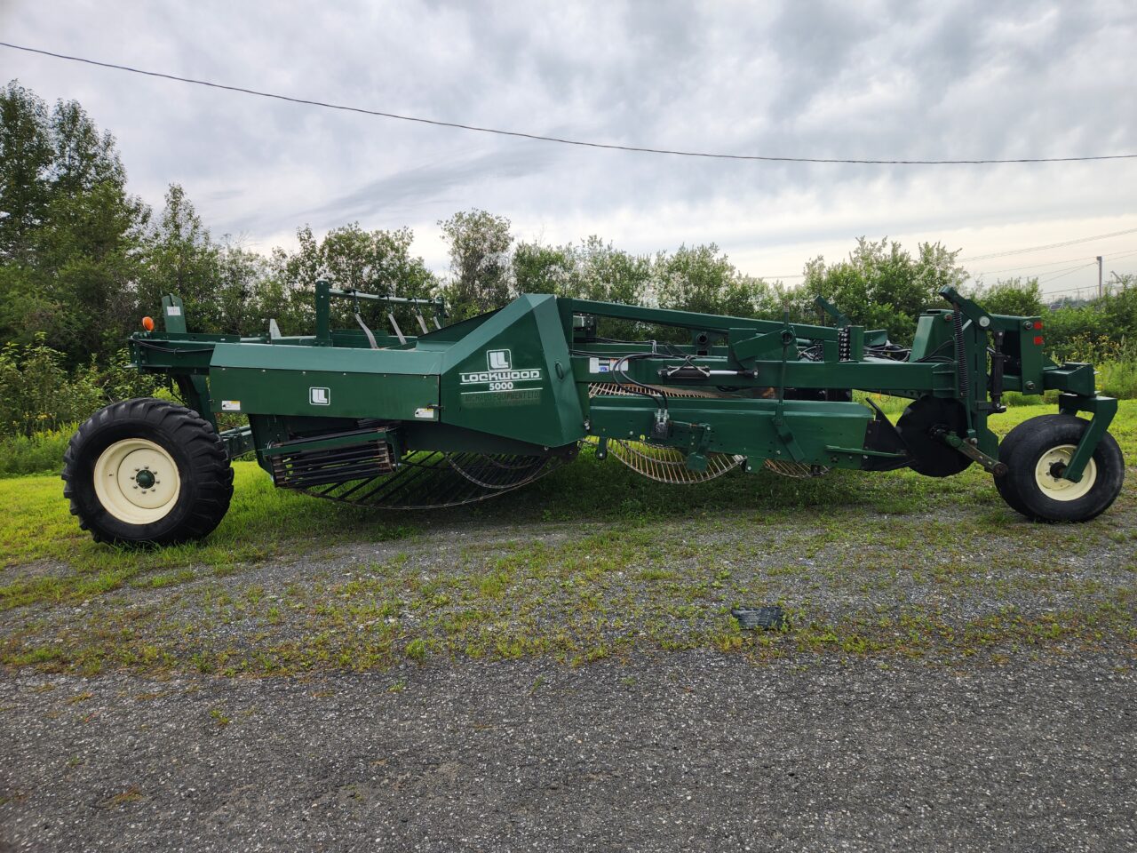 5000 Reconditioned 4-Row Windrower | Lockwood